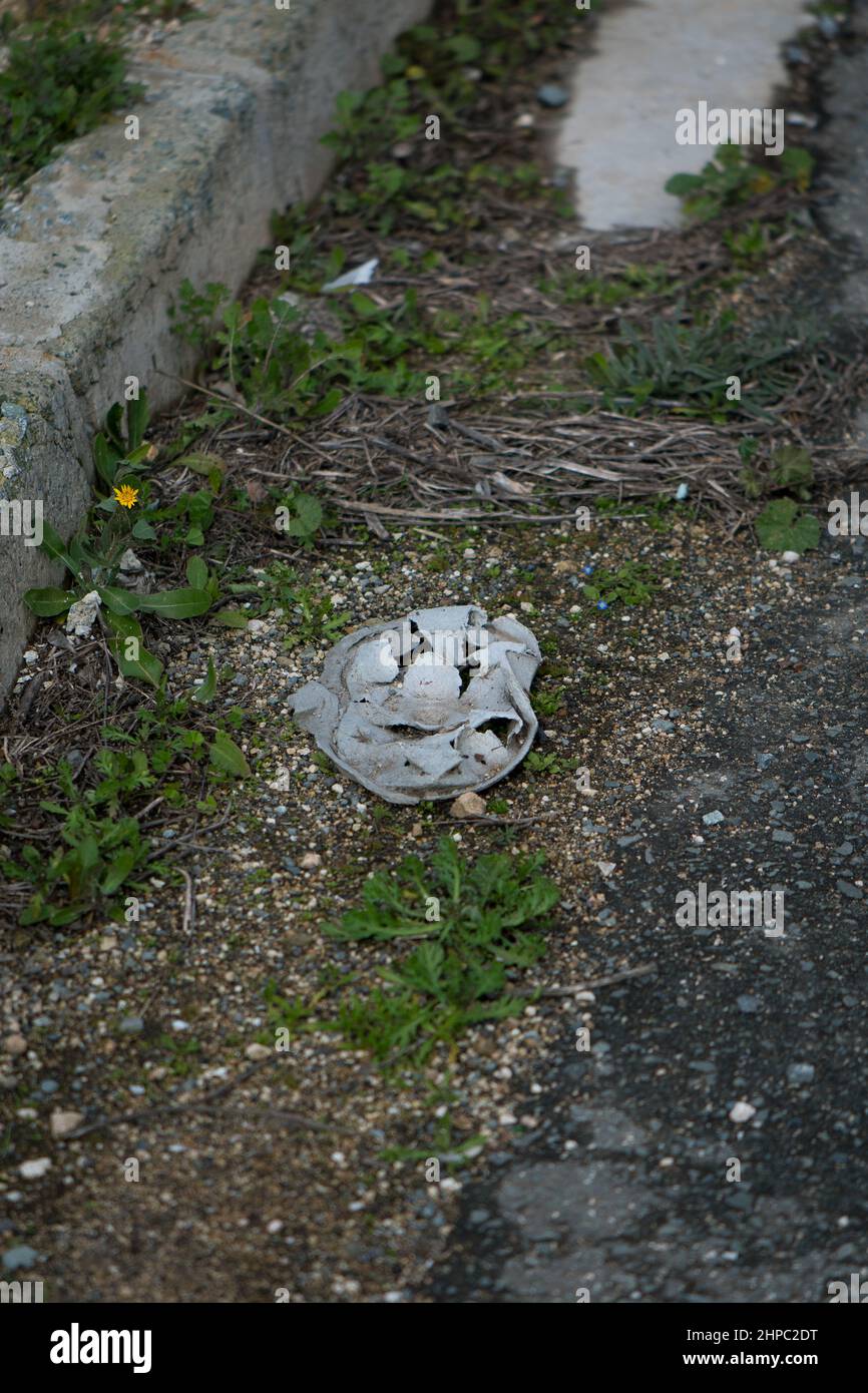 Vertical shot of garbage in the sidewalk Stock Photo - Alamy