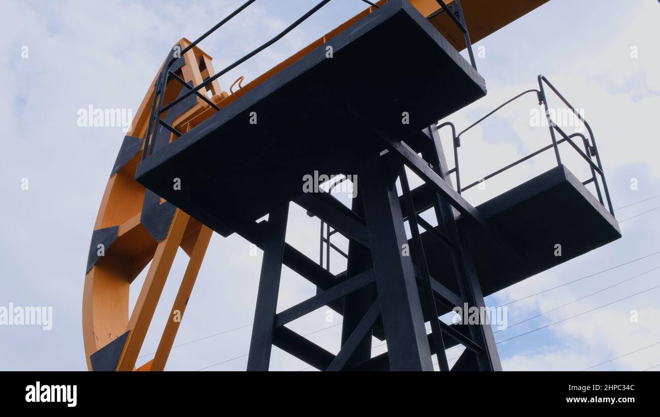 Oil and gas production equipment running on a summer day. The concept ...