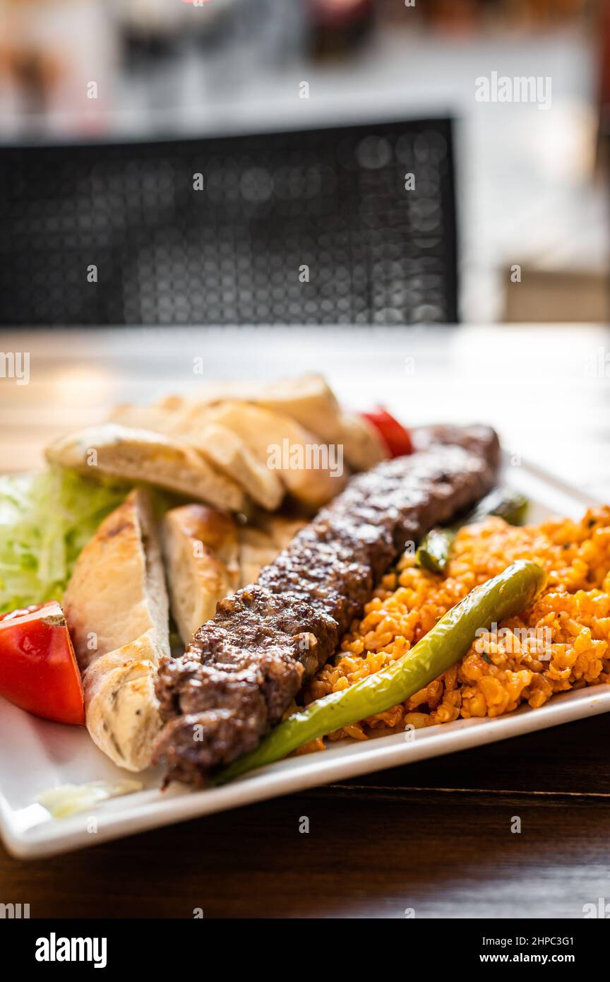 Traditional Turkish Adana kebab or kebap meat food with marinated ...