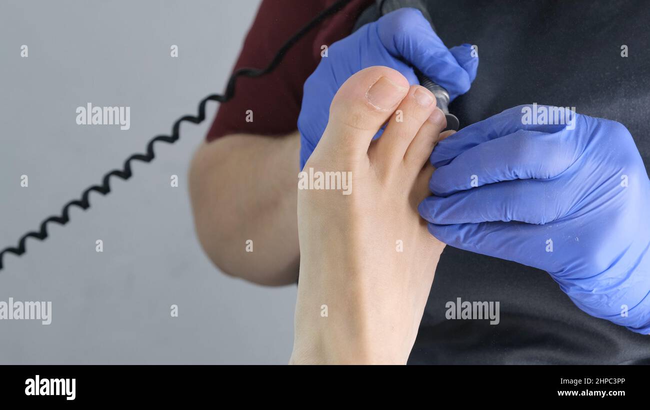 Patient on medical pedicure procedure, visiting podiatrist.Professional ...