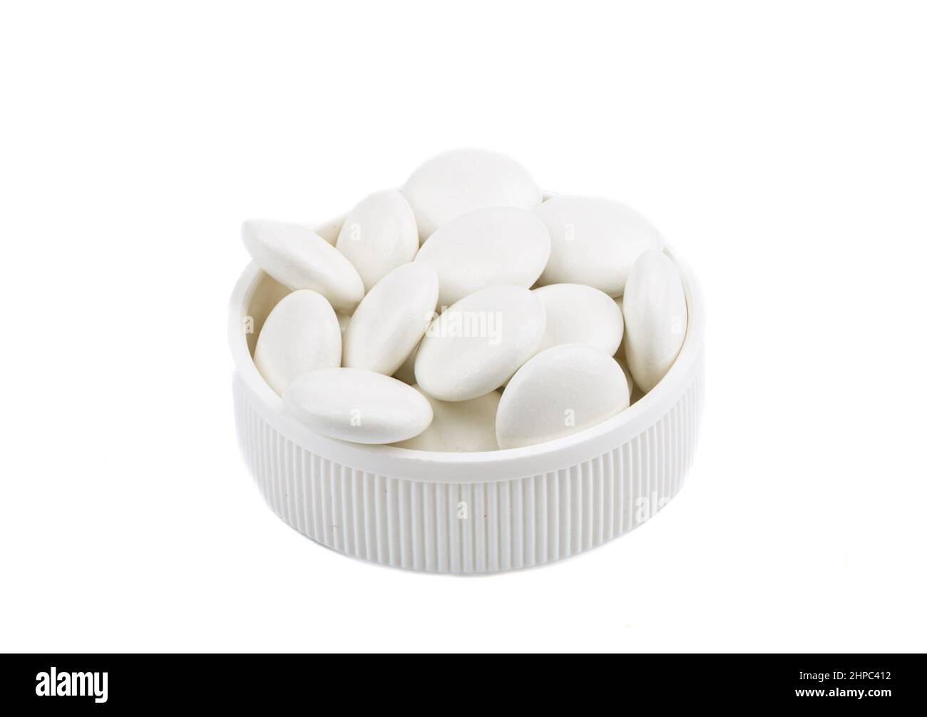 Medical pills in a plastic cap isolated on a white background. Copy ...