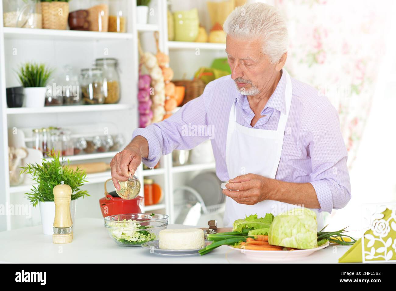 Chef cooking in kitchen, cook preparing food Stock Photo - Alamy