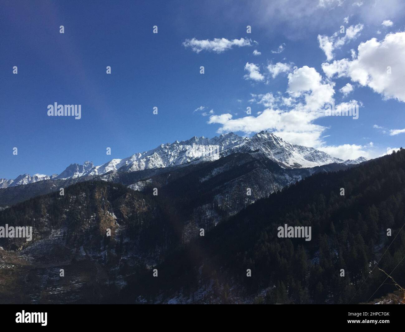 Beautiful alpine background with the blue sky Stock Photo - Alamy
