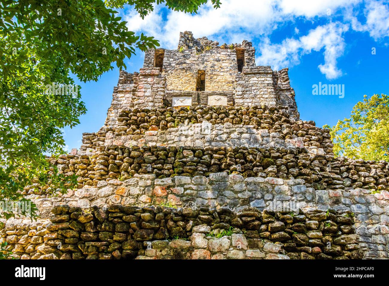 Ancient Mayan site with temple ruins pyramids and artifacts in the ...