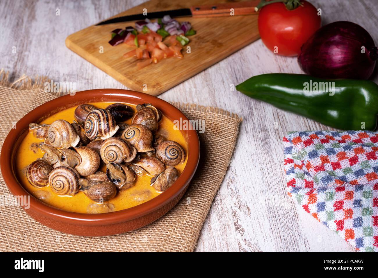 Snail stew, dish based on a sauce of vegetables and cooked snails Stock ...