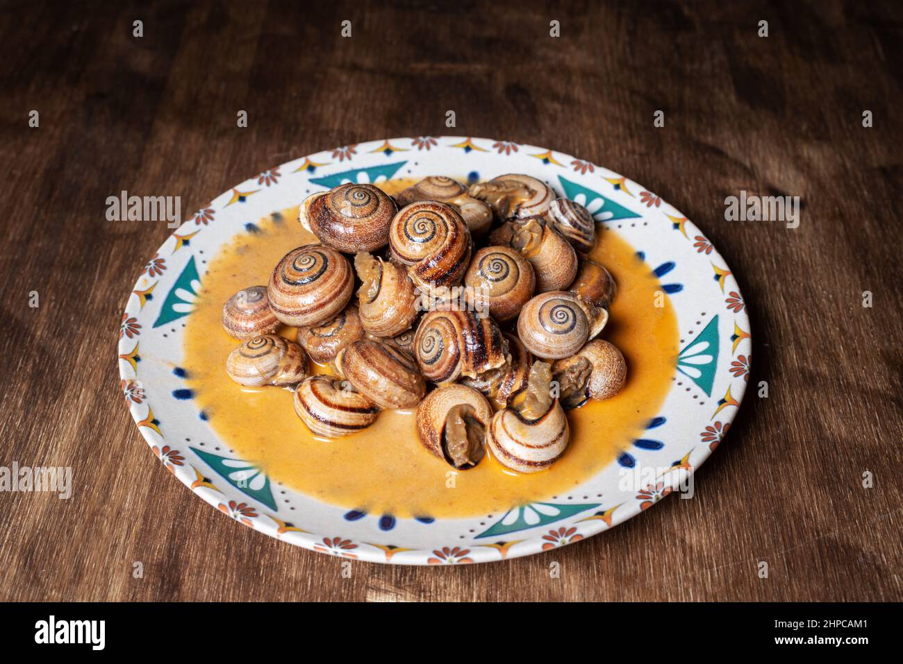 Snail stew, dish based on a sauce of vegetables and cooked snails Stock ...