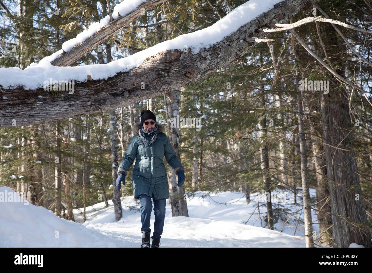Eben Junction, Michigan - Susan Newell, 73, hikes on a trail in the ...