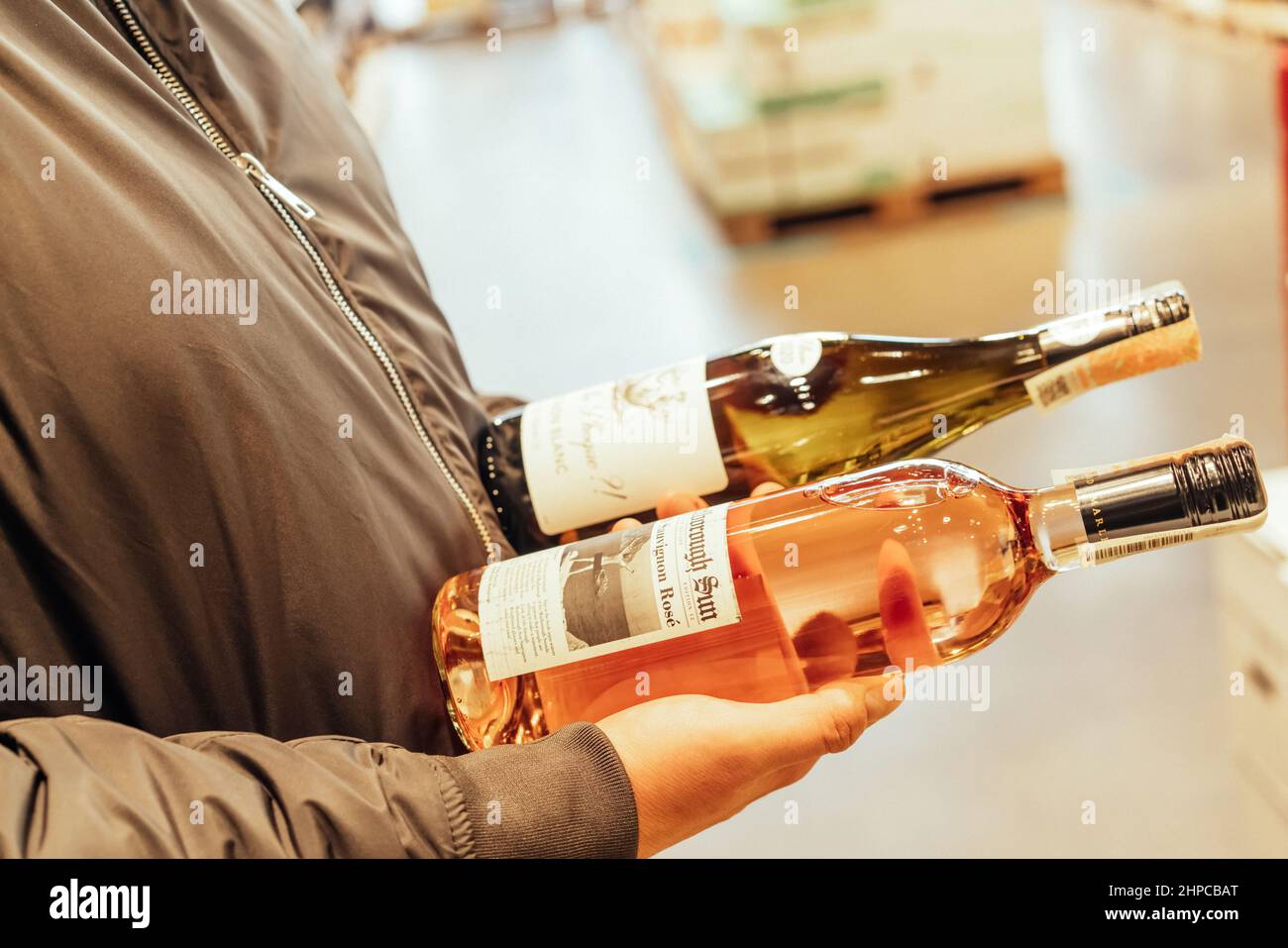 Lviv, Ukraine - February 20, 2022 : Bad Boy store, customer reading ...