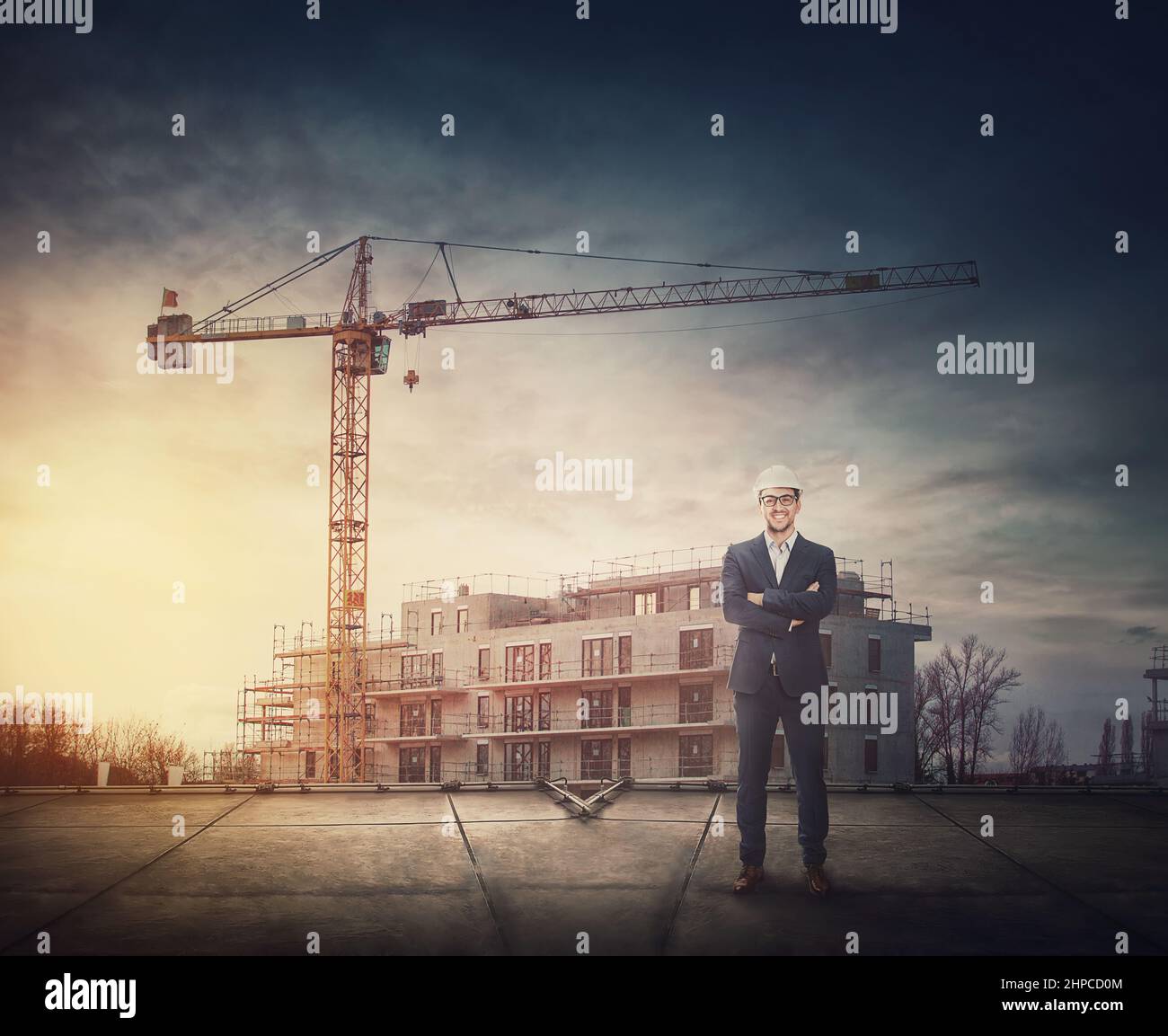 Man contractor or architect wearing protective helmet stands confident ...