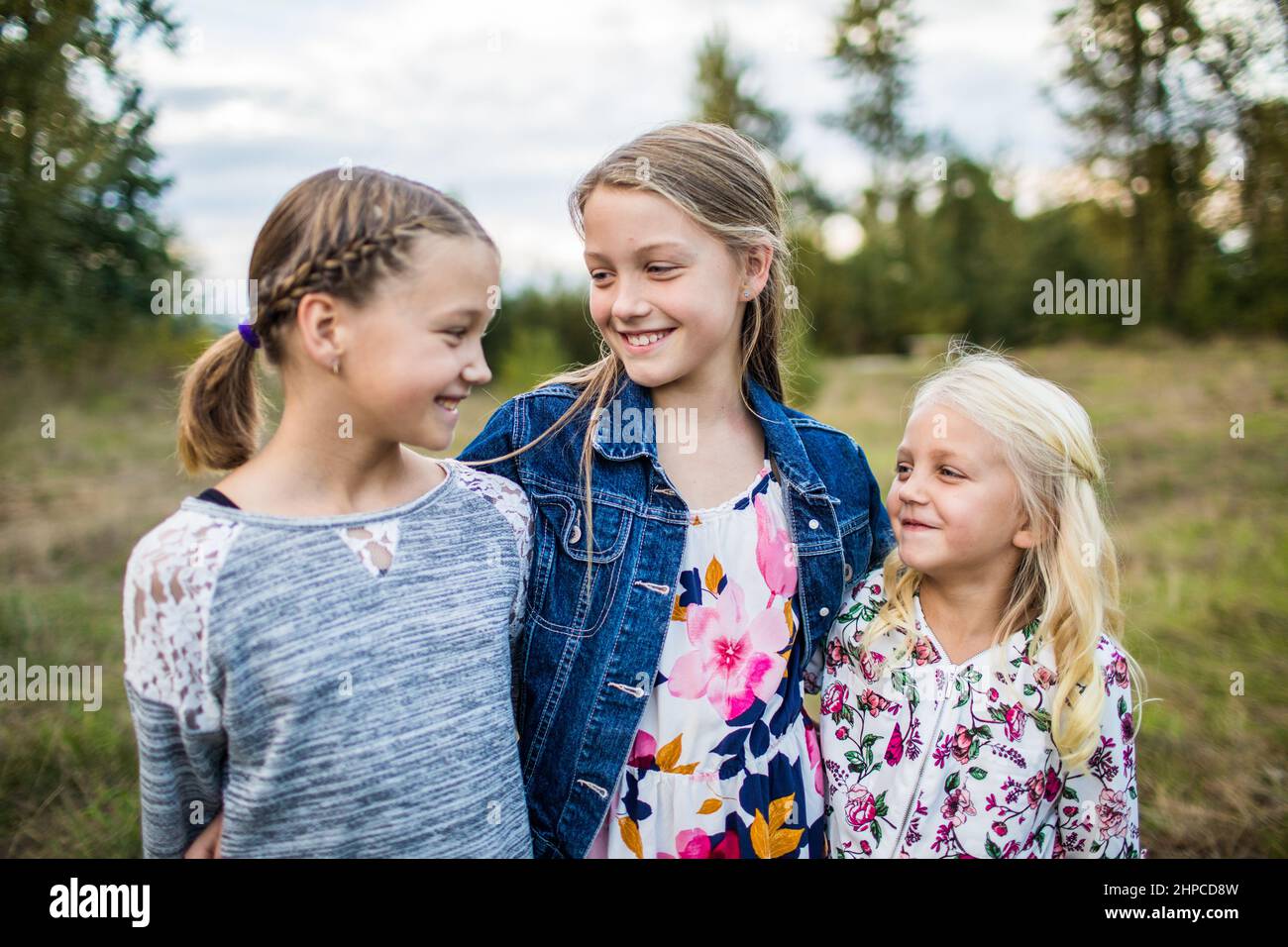 Three beautiful girls smiling, laughing, smiling outdoors Stock Photo ...