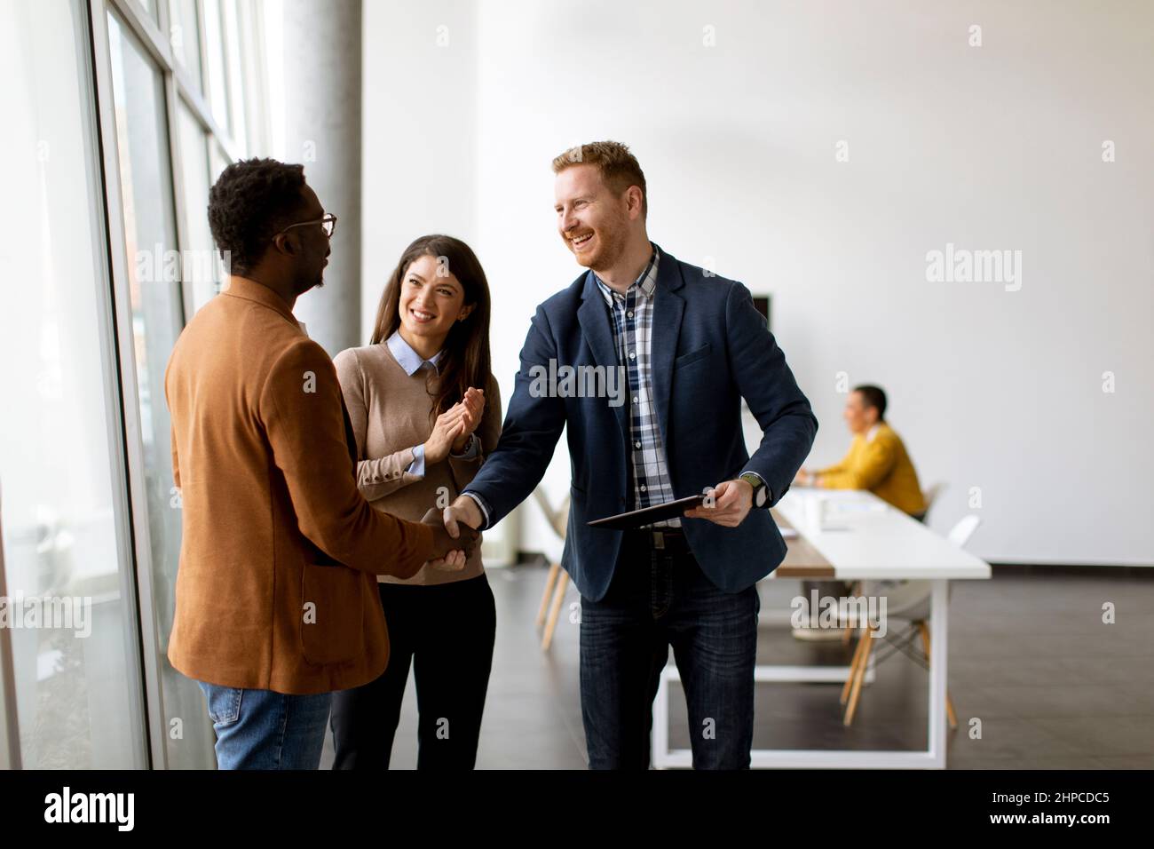 Group of young multiethnic business people working together and ...