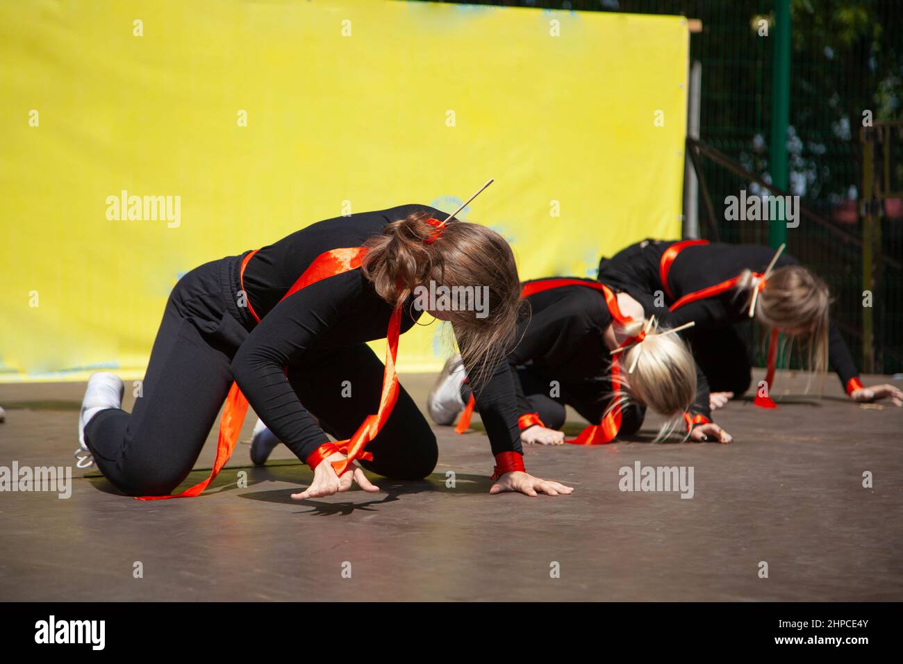 Girls are dancing on stage. Dance group performance Stock Photo - Alamy