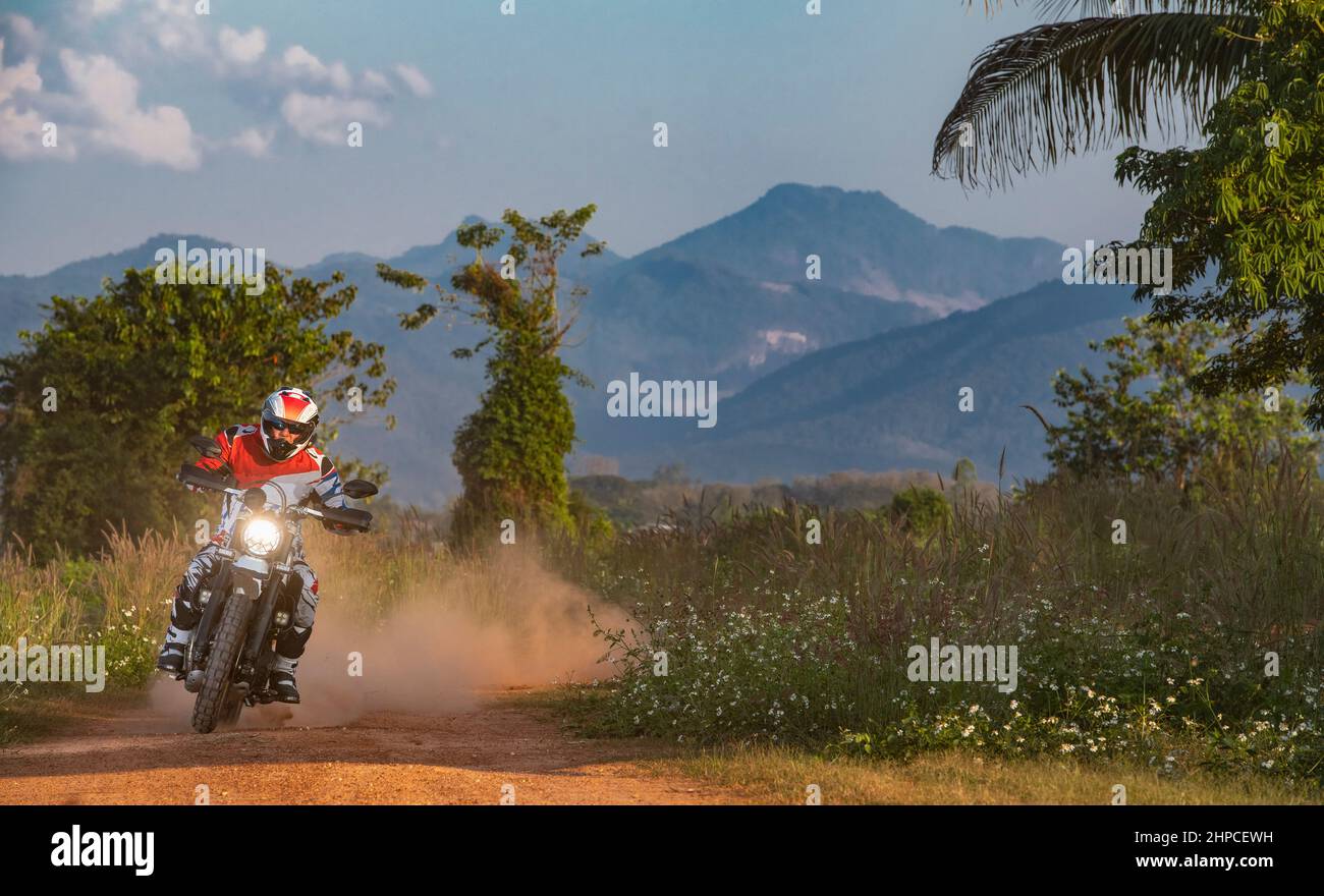 man riding his scrambler type motorcycle in north Thailand Stock Photo ...