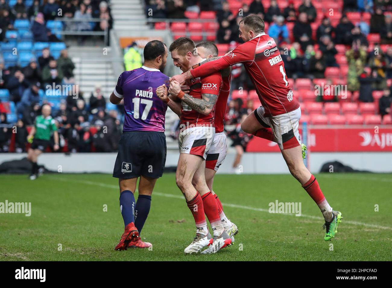 Marc Sneyd #7 of Salford Red Devils goes over for a try and celebrates ...