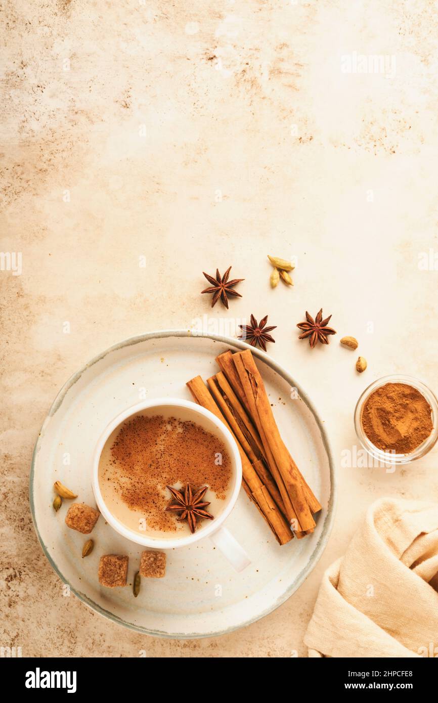 Masala tea. Masala chai spiced tea with milk and spices on light warm ...