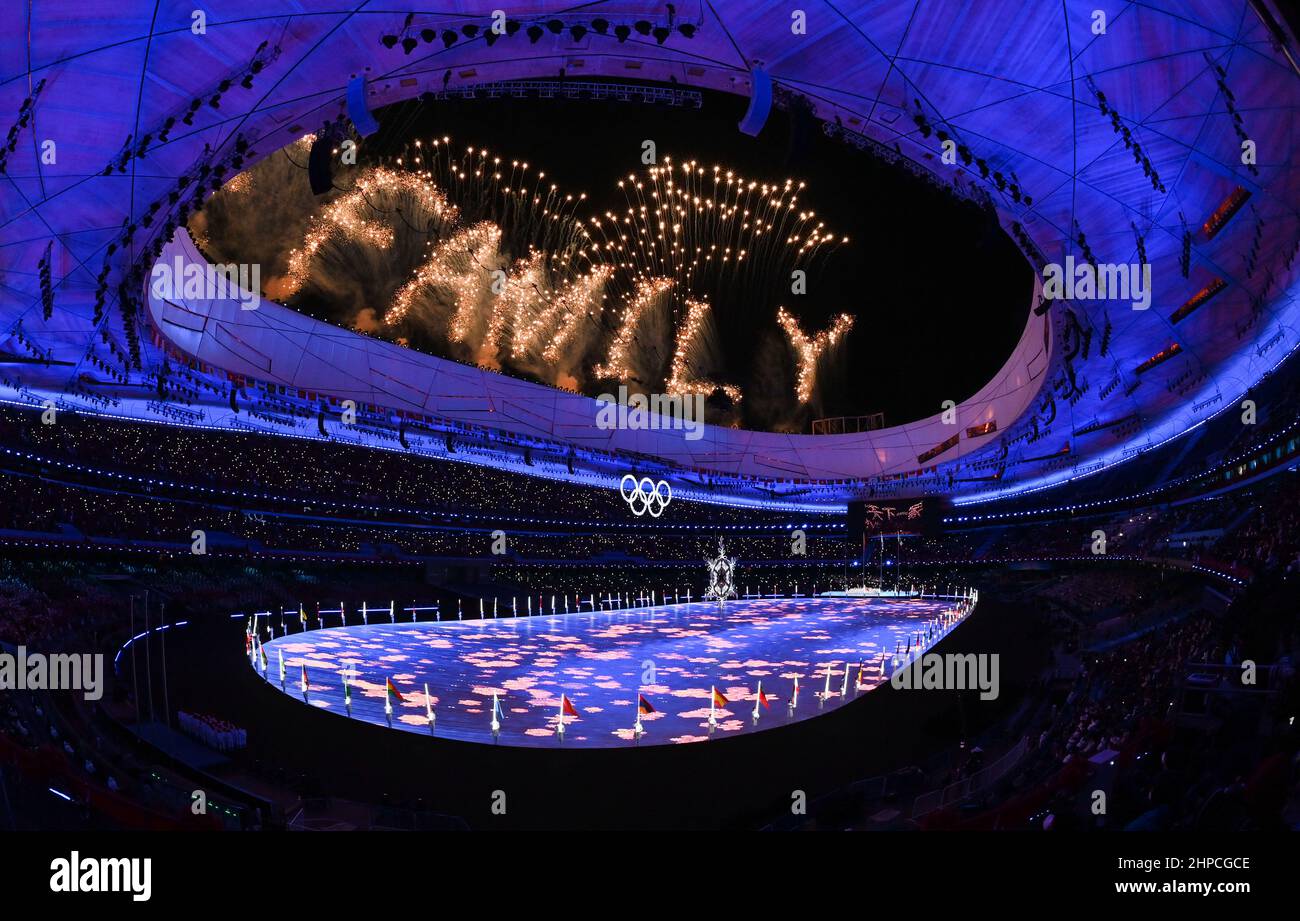 Beijing, China. 20th Feb, 2022. Fireworks illuminate the night sky ...