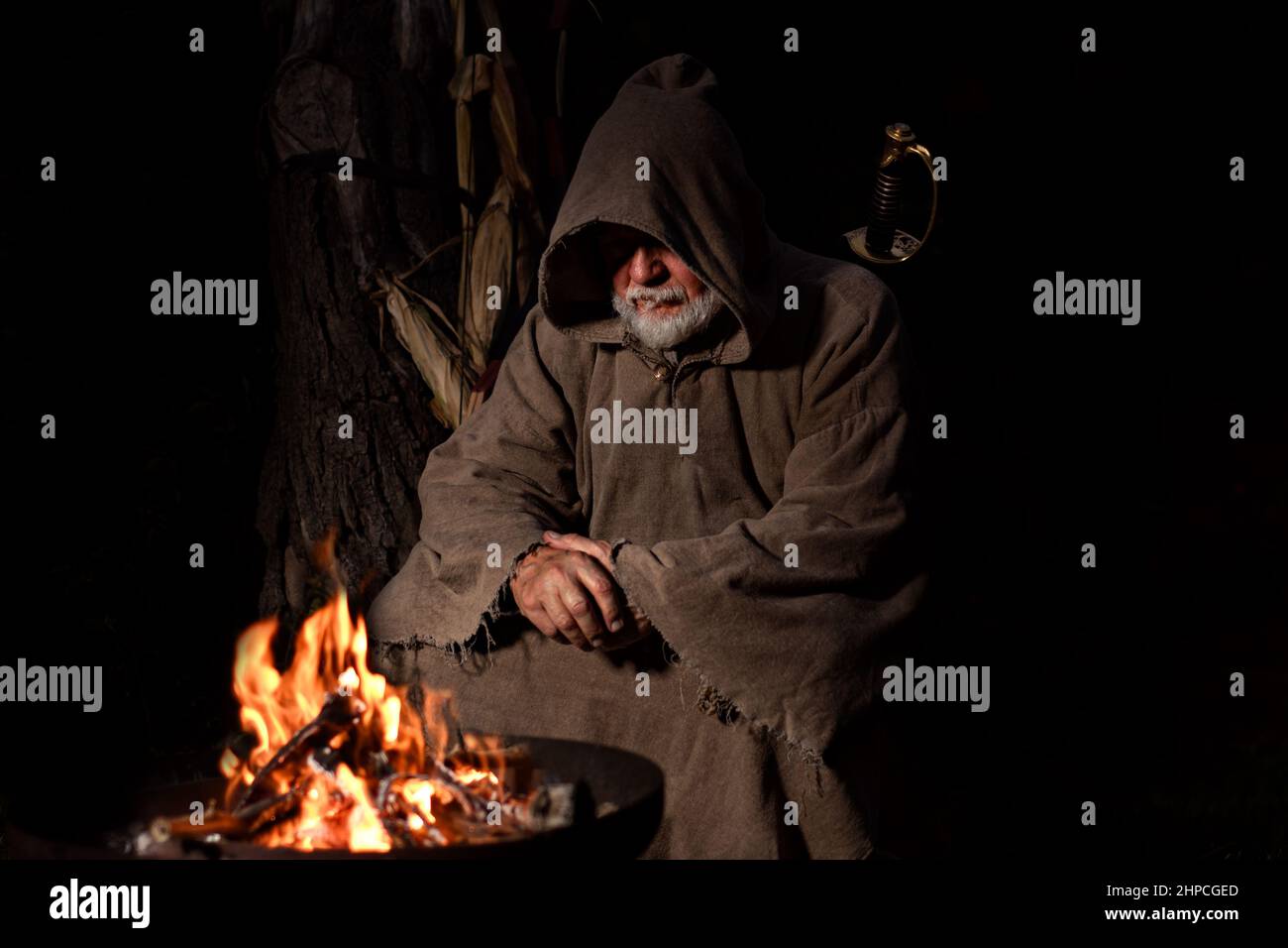 A Medieval poor warrior around the campfire Stock Photo - Alamy