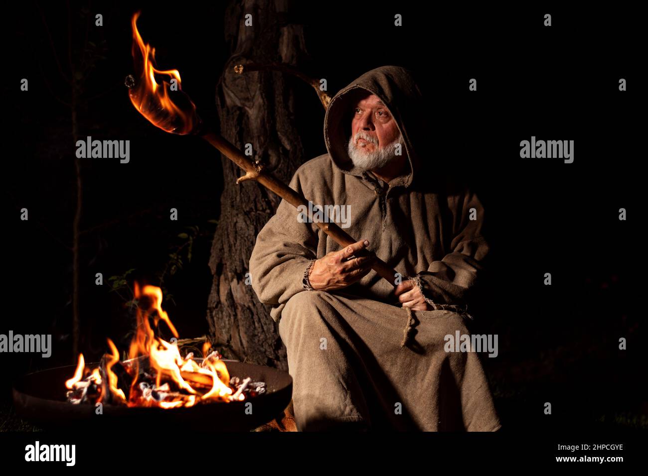 Angry poor farmer in the middle ages with a torch Stock Photo - Alamy