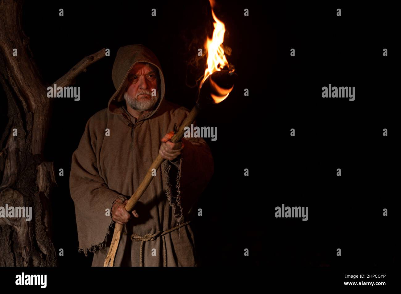 Angry farmer with torch in the middle ages Stock Photo - Alamy