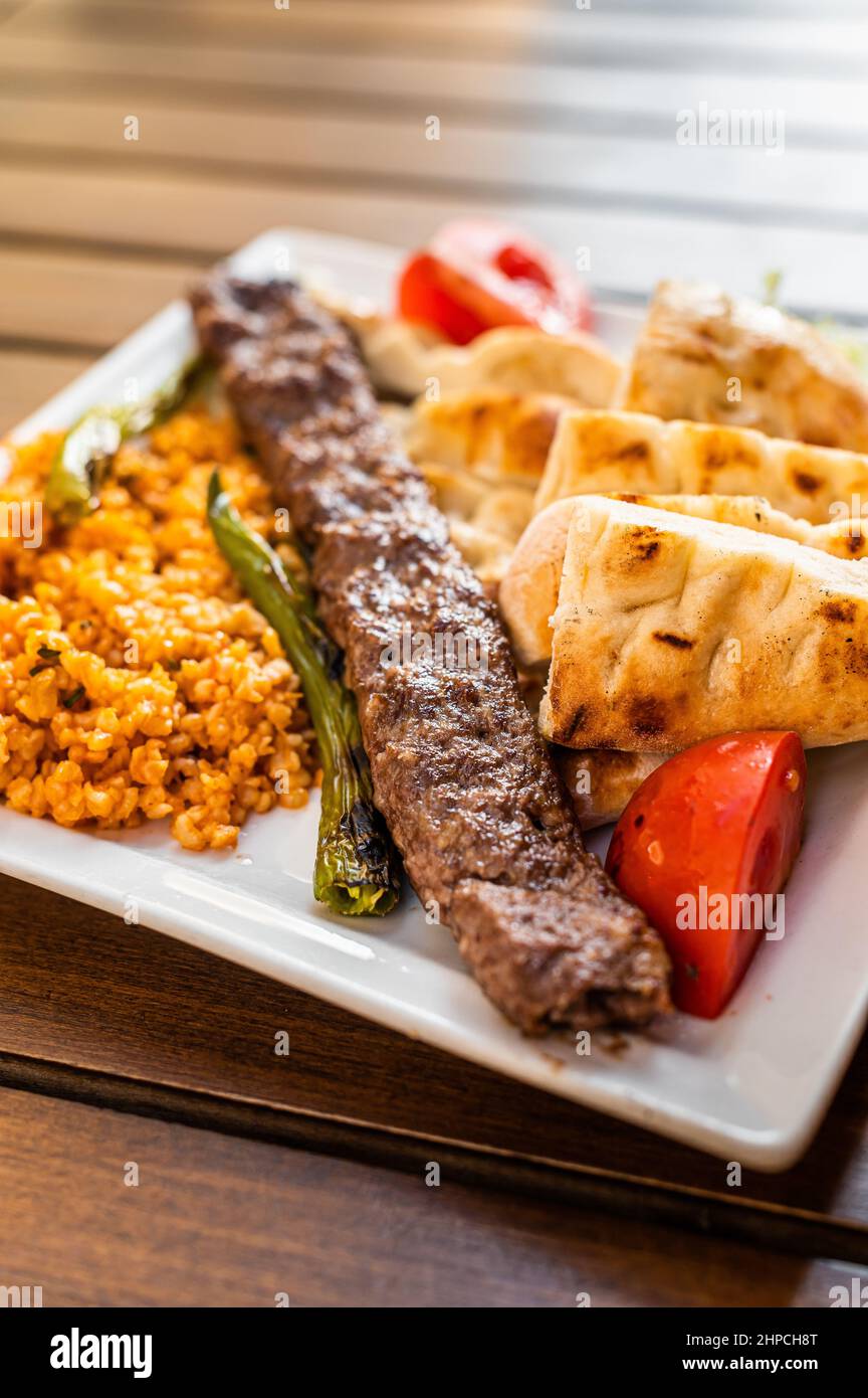 Traditional Turkish Adana kebab or kebap meat food with marinated ...