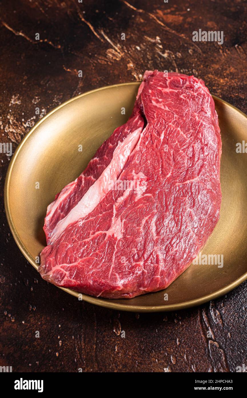 Marbled prime beef steak, raw top sirloin meat steak. Dark background ...
