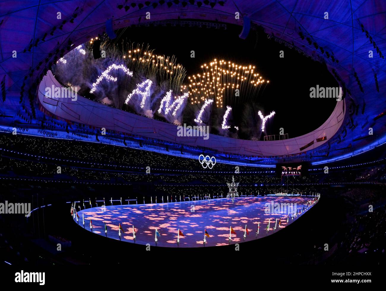 Beijing, China. 20th Feb, 2022. Fireworks illuminate the night sky ...