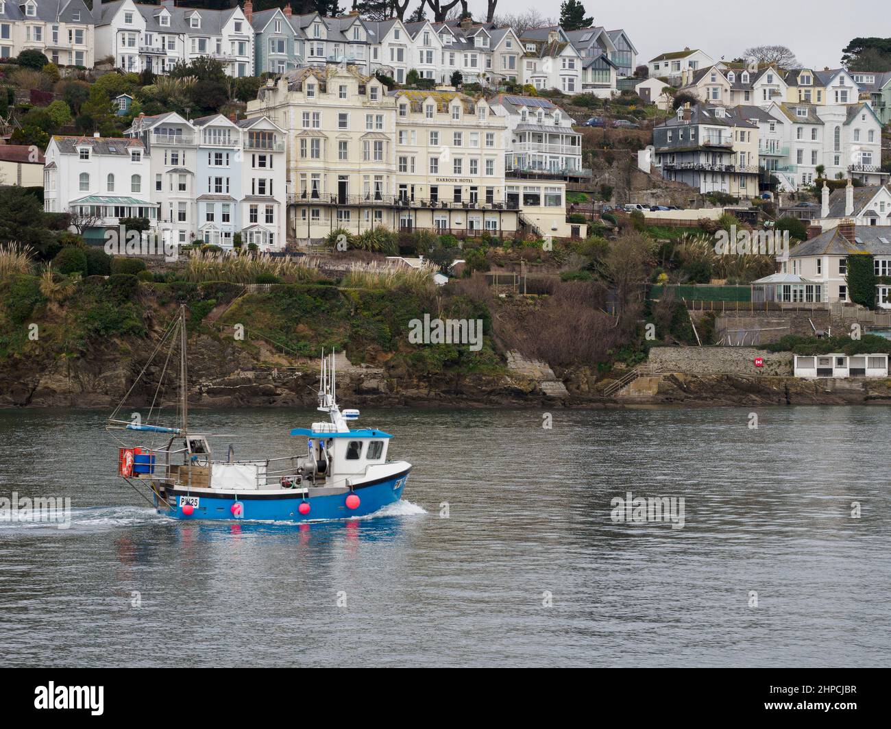 Fishing trawler passing the Harbour Hotel on it's way up the River ...