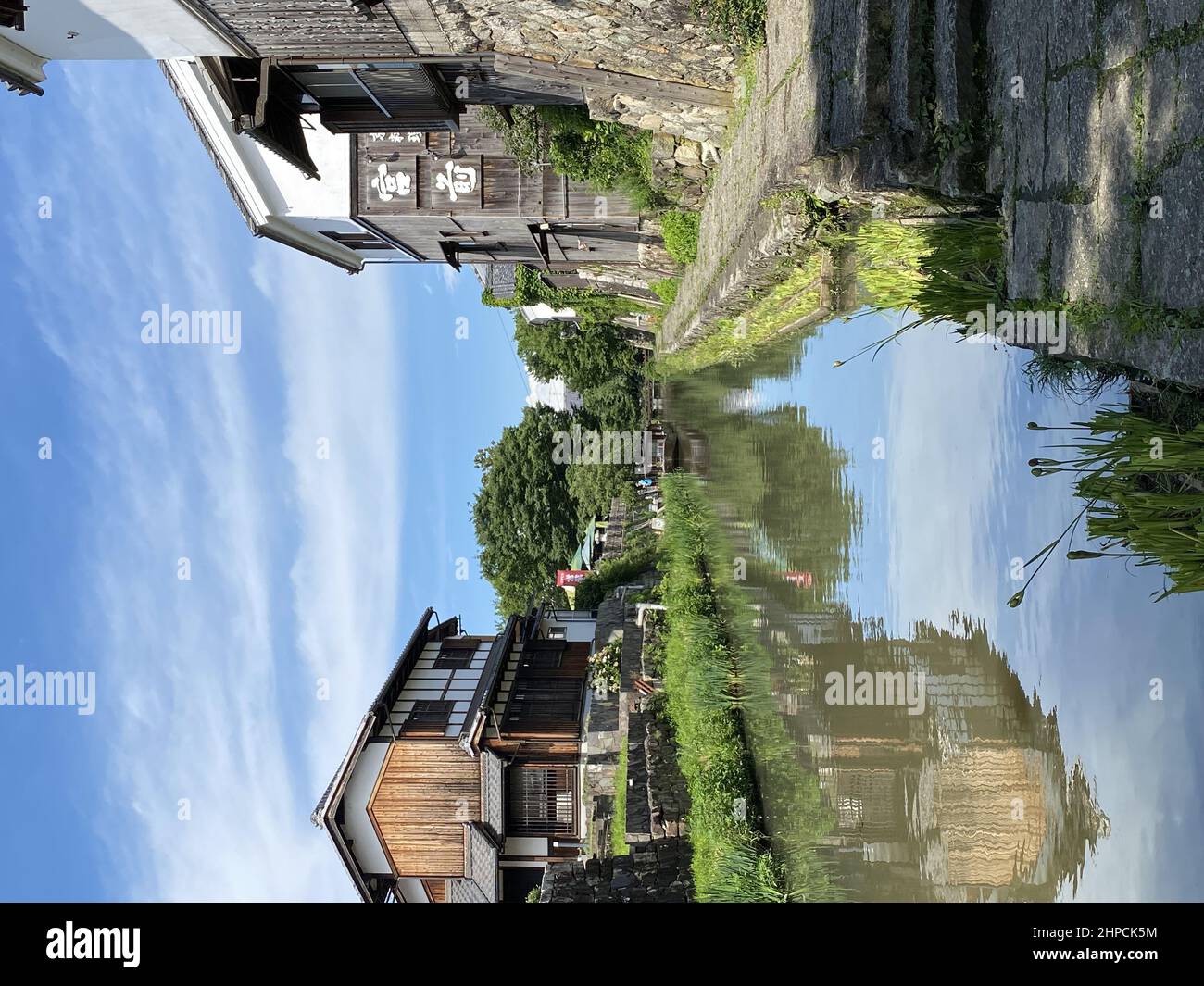 Scenic view of a river flowing through the residential area with houses ...