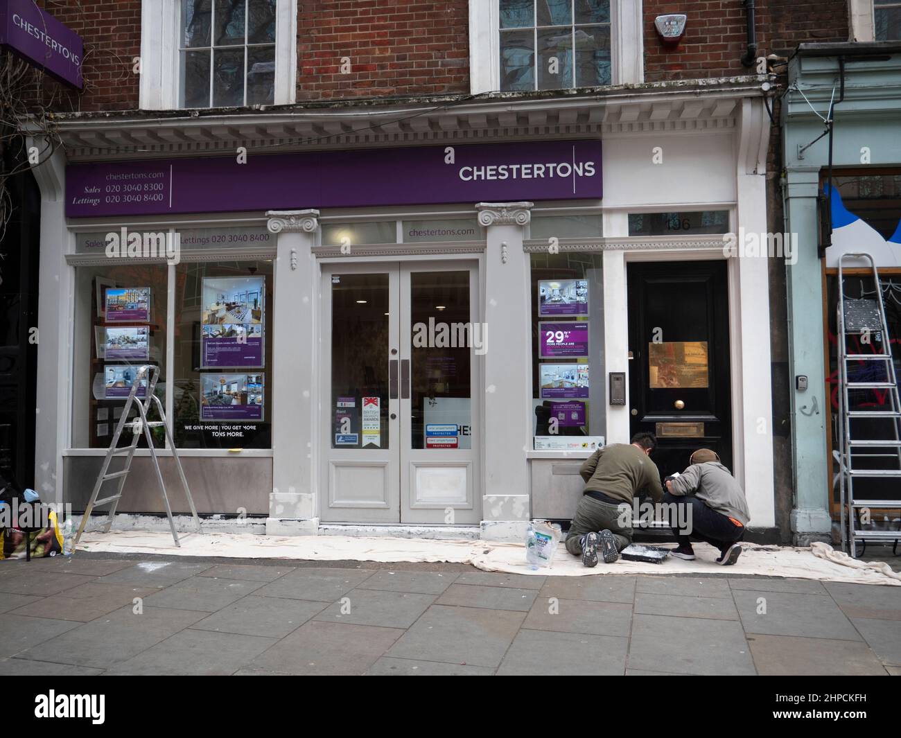 Chestertons Estate agent shop front being painted Stock Photo - Alamy