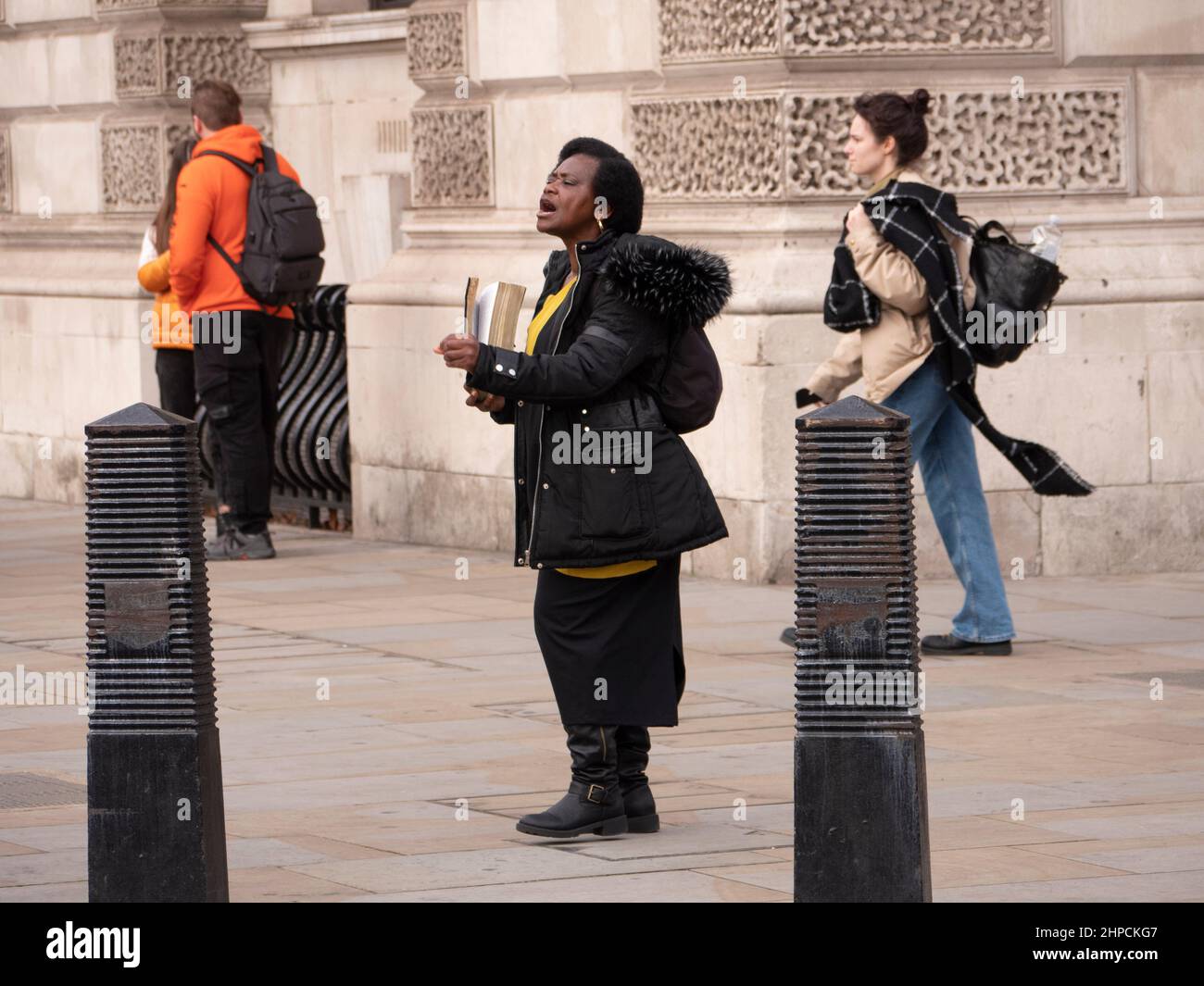 Evangelist Christian street preacher, with Holy Bible, preaching to ...