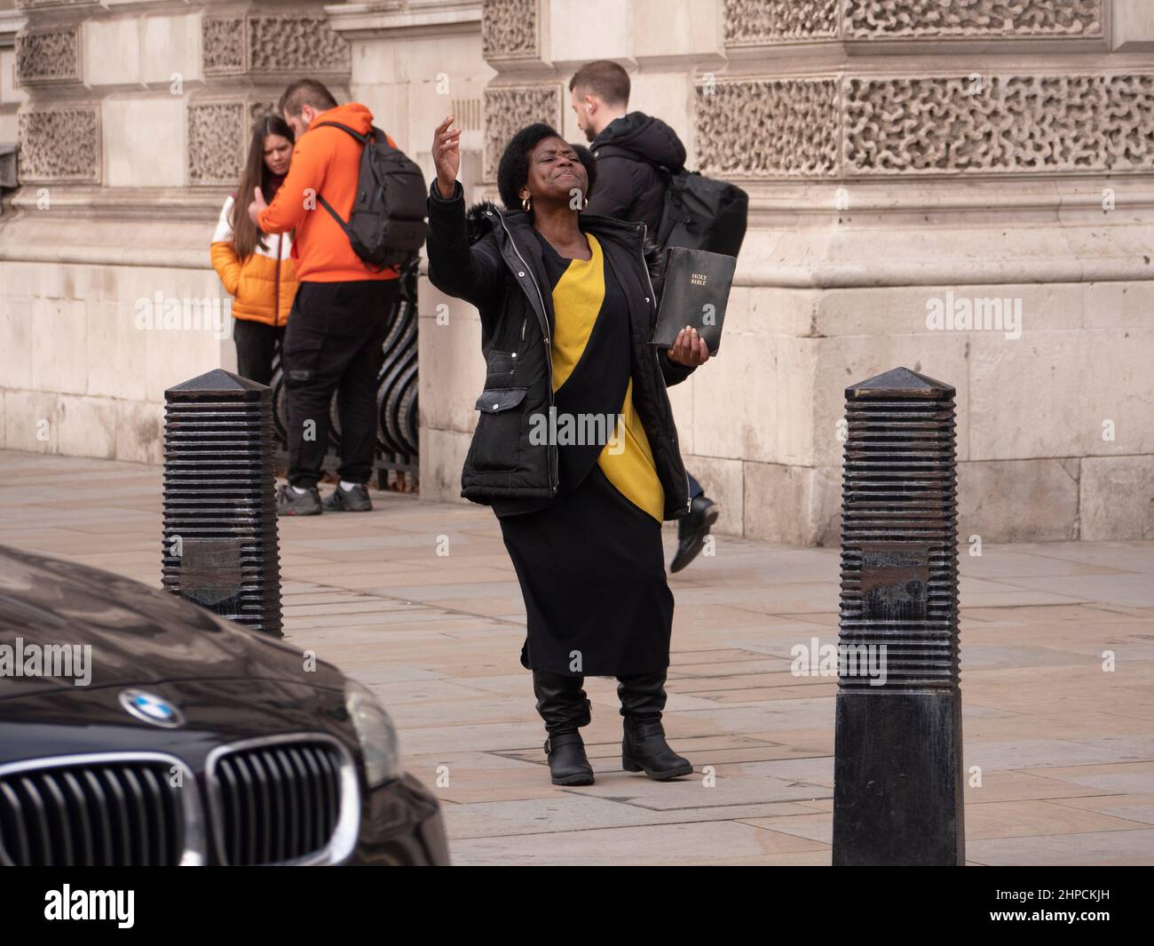 Evangelist Christian street preacher, with Holy Bible, preaching to ...