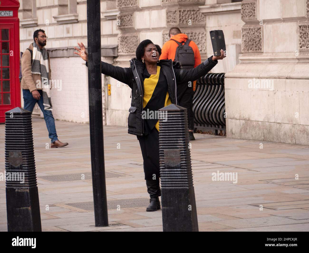 Evangelist Christian street preacher, with Holy Bible, preaching to ...