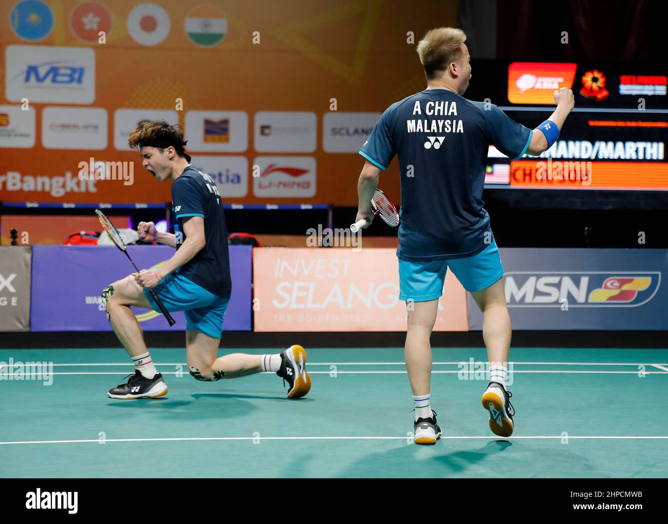 Aaron Chia (R) and Soh Wooi Yik of Malaysia celebrate after defeating Carnando Leo Rolly and ...