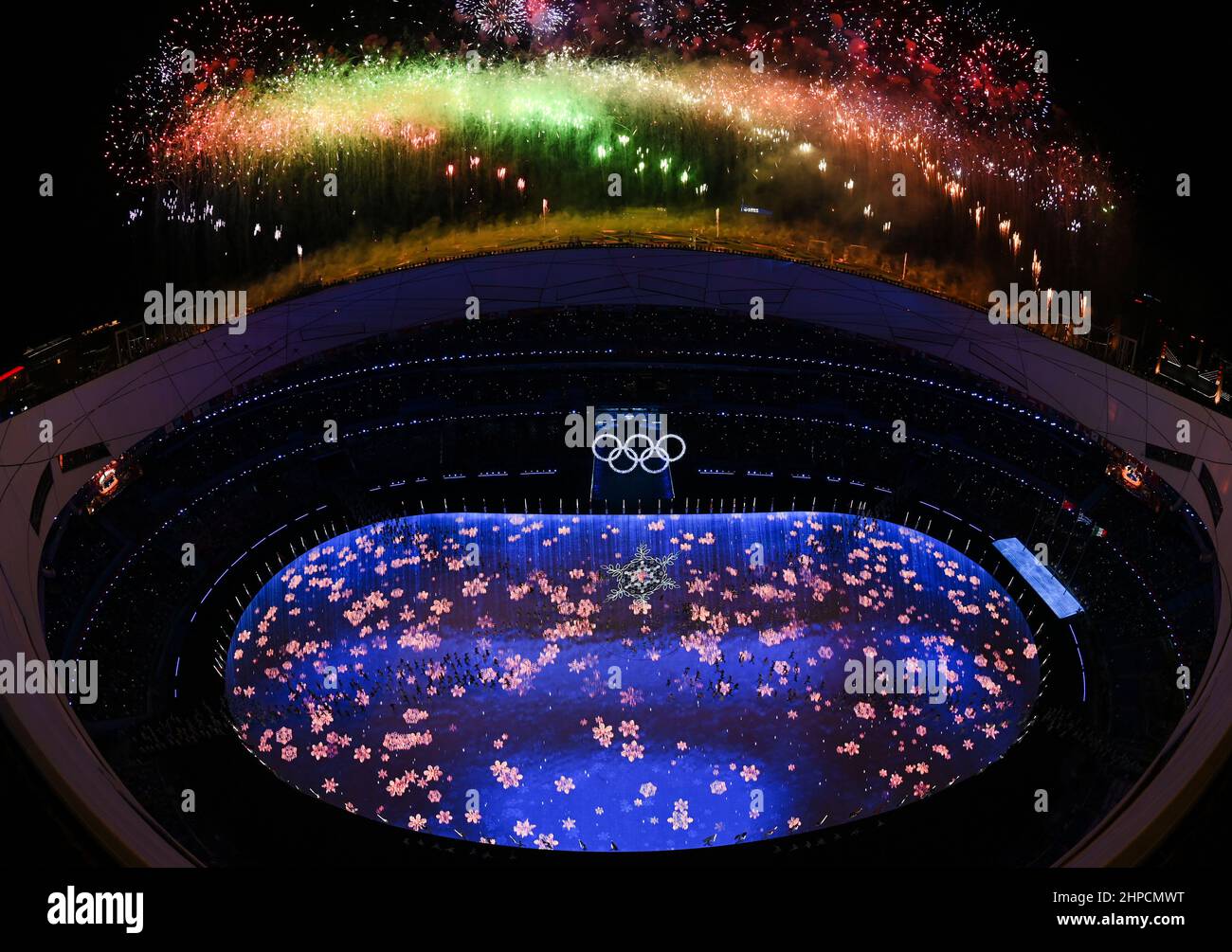 Beijing, China. 20th Feb, 2022. Fireworks illuminate the night sky ...