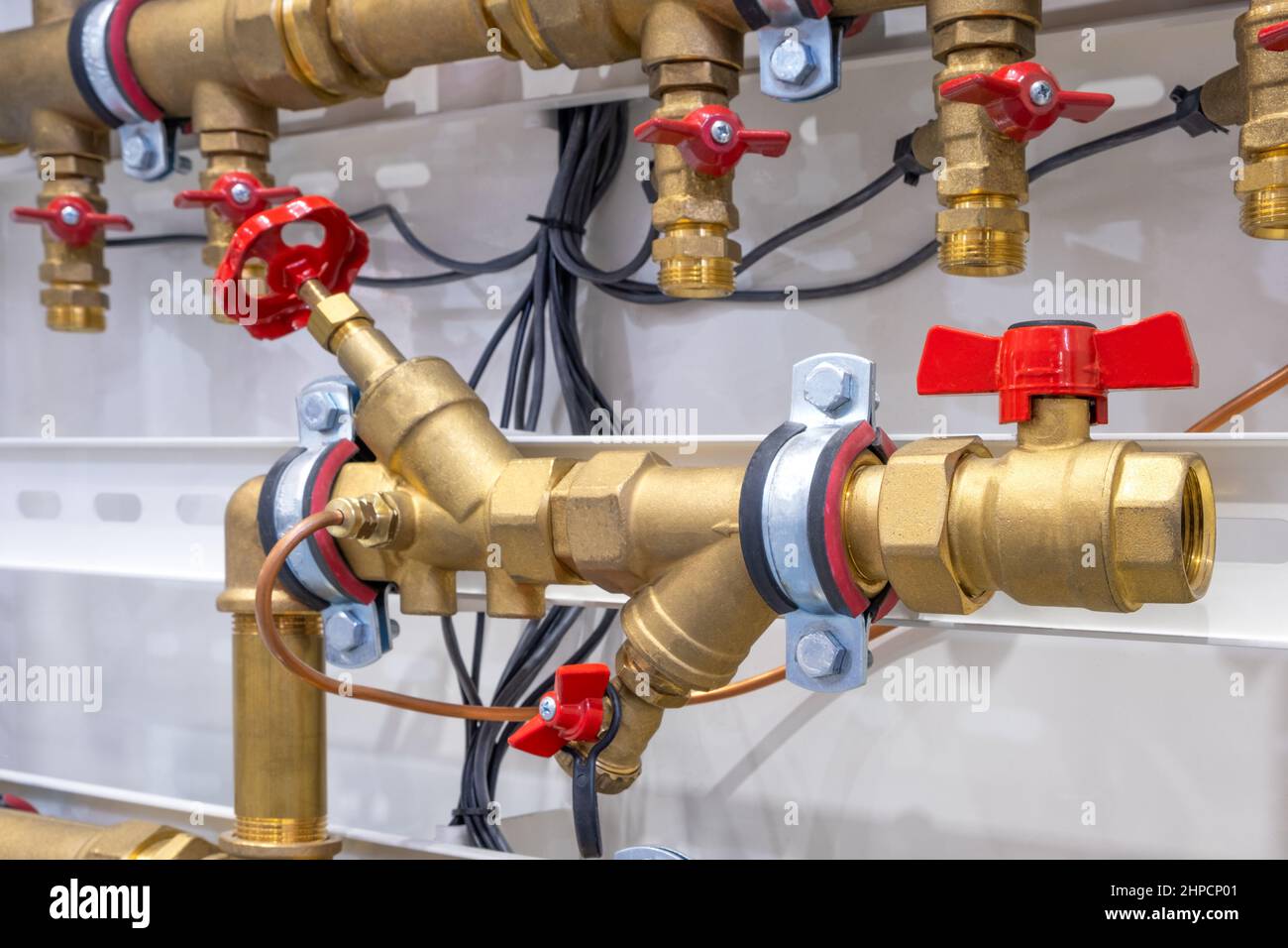 pipes and faucet valves of heating system in a boiler room Stock Photo ...