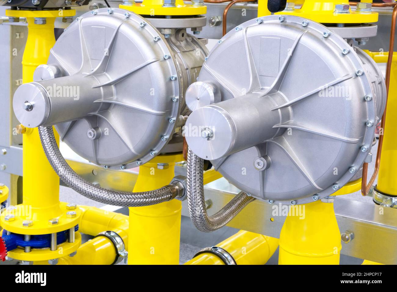 The gas pipeline is yellow with additional equipment, pipes and a valve ...