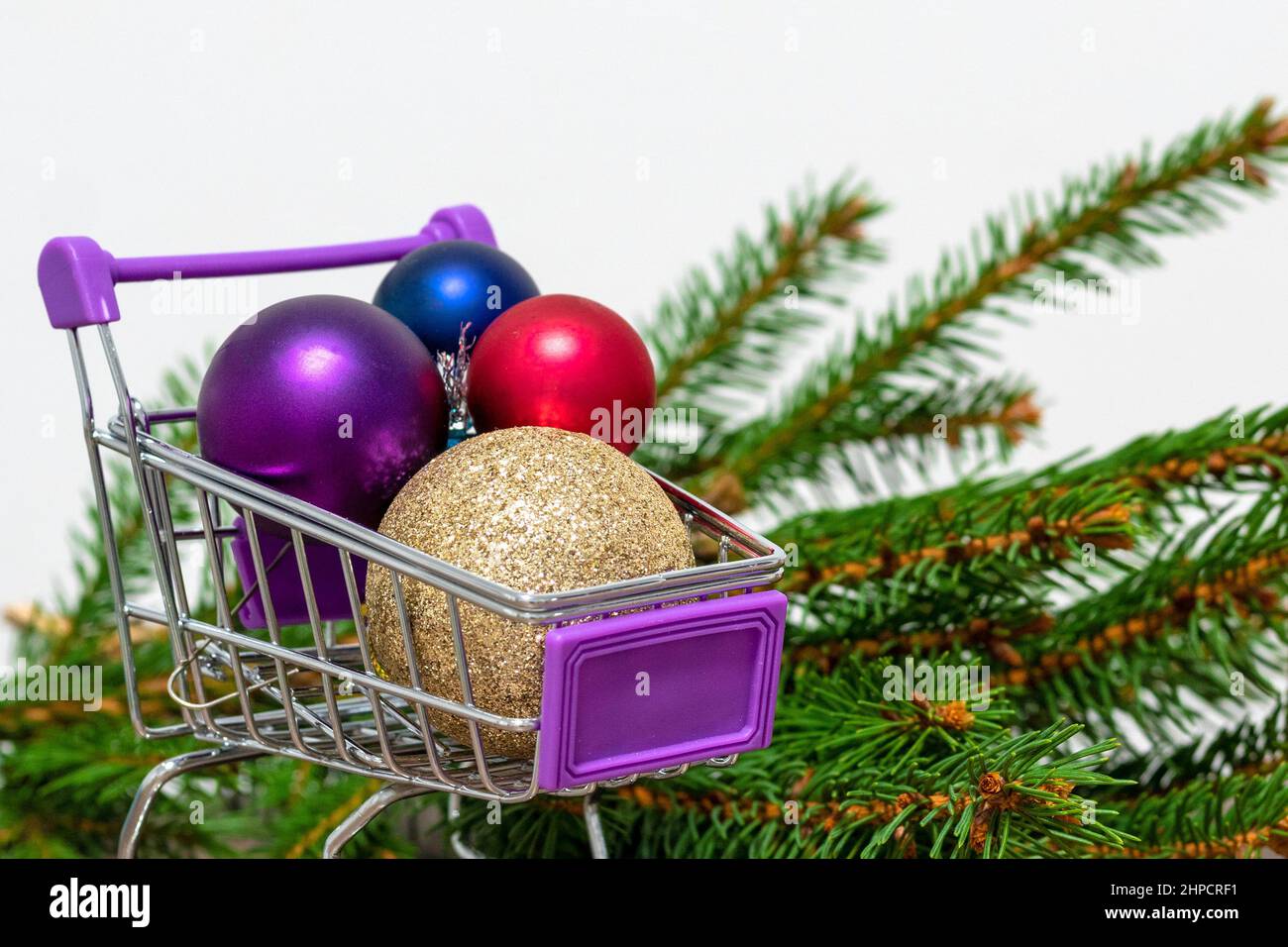 Trolley with Christmas decorations. Branches of a Christmas tree. Cart ...