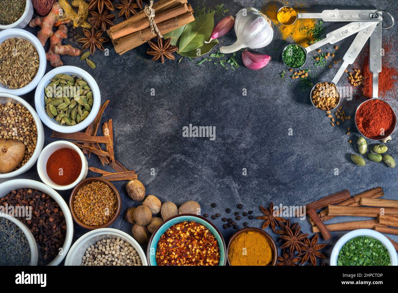 Selection of spices used in cooking to ad. flavor and seasoning. Space ...