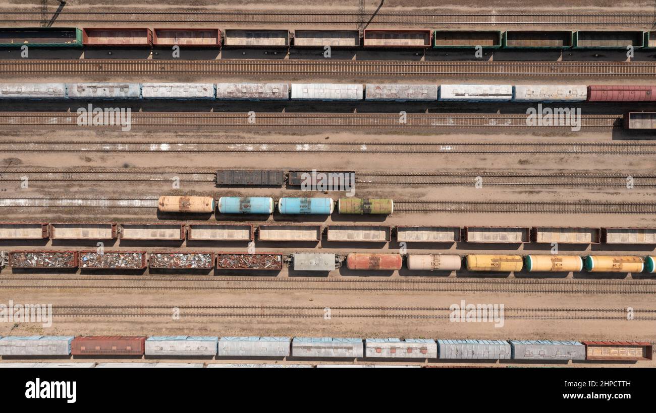 Aerial view of rail sorting freight station with railway cars, tracks ...