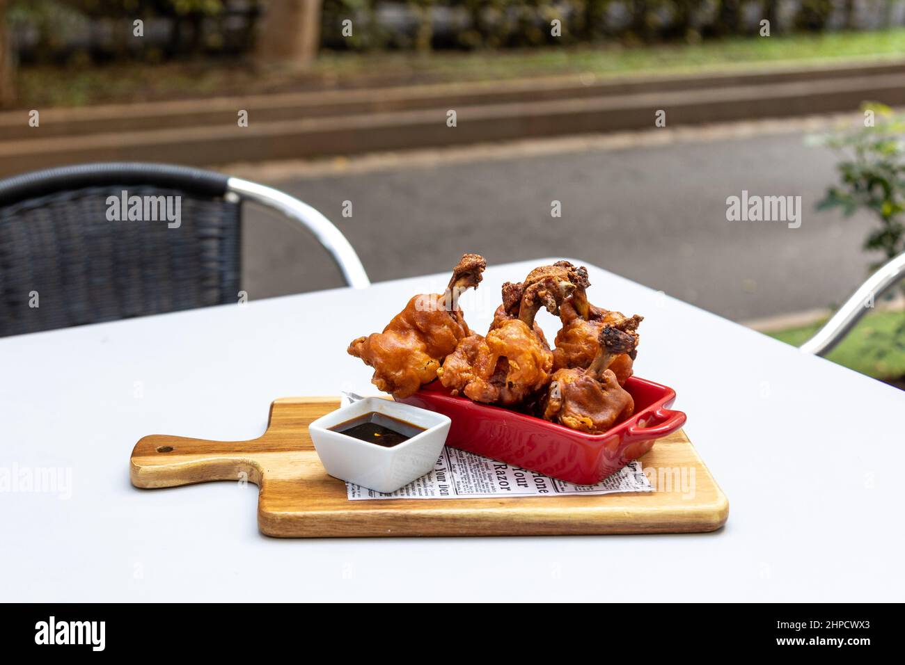 Closeup picture of chicken portions and a sauce Stock Photo - Alamy