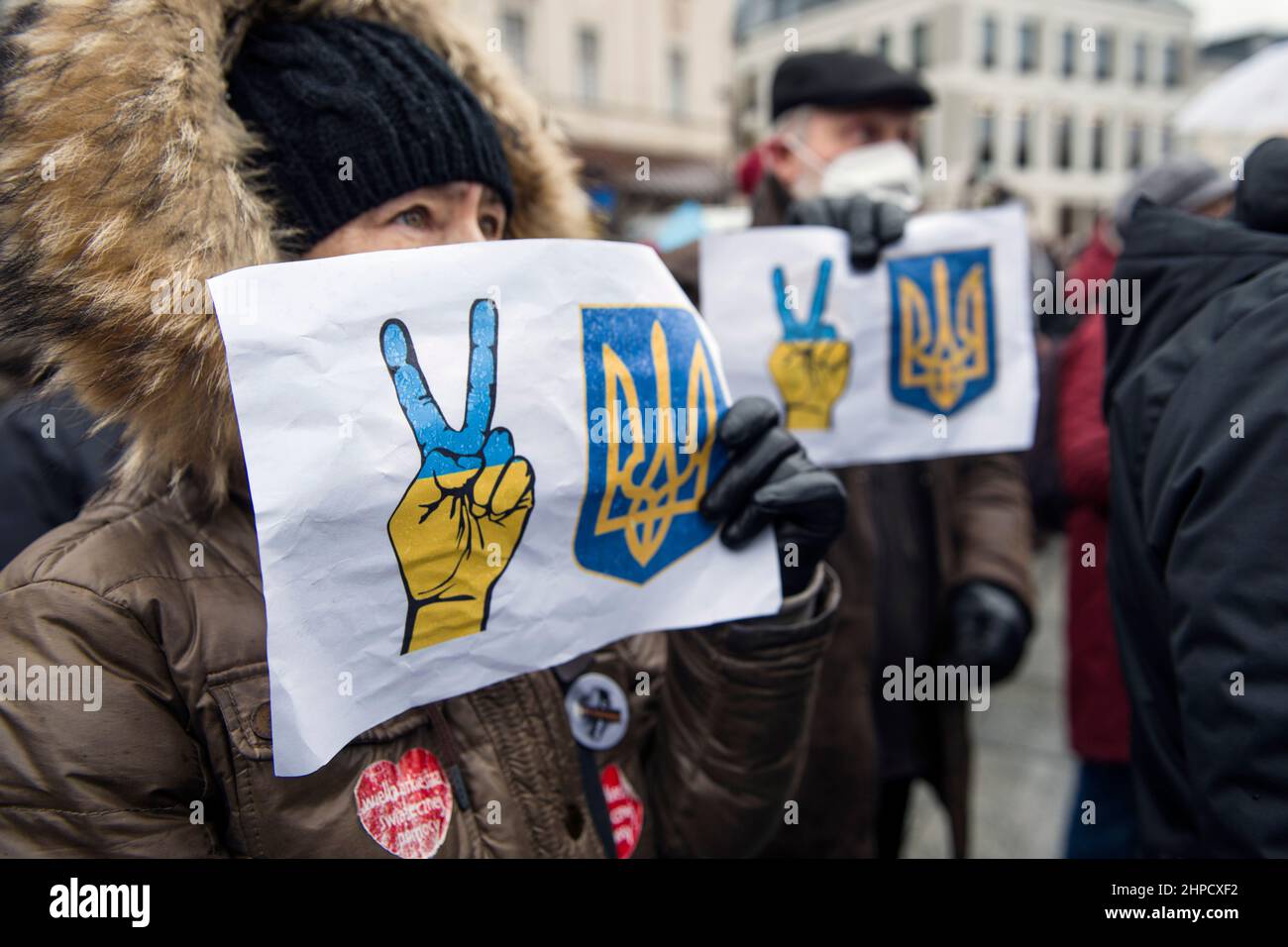 Protesters hold placards expressing their opinions during the ...
