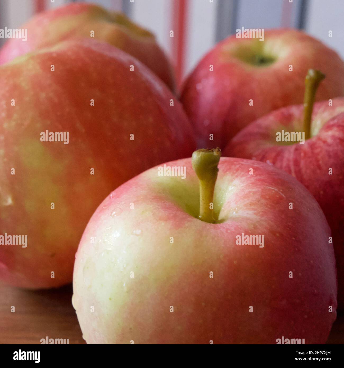 A few ripe striped apples, a close-up shot. Apples of the gala and ...