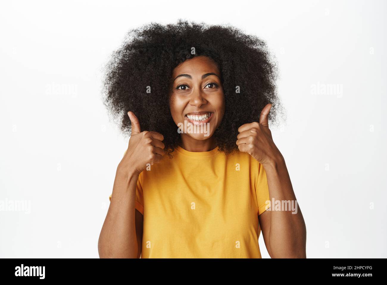 Very good, great job. Smiling happy african woman shows thumbs up, like ...