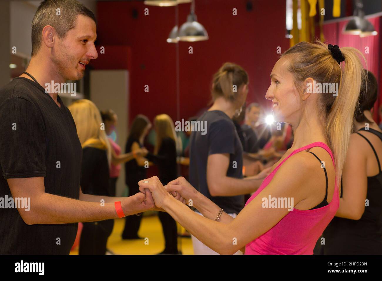 Positive couple dancing in pairs in dance hall Stock Photo - Alamy