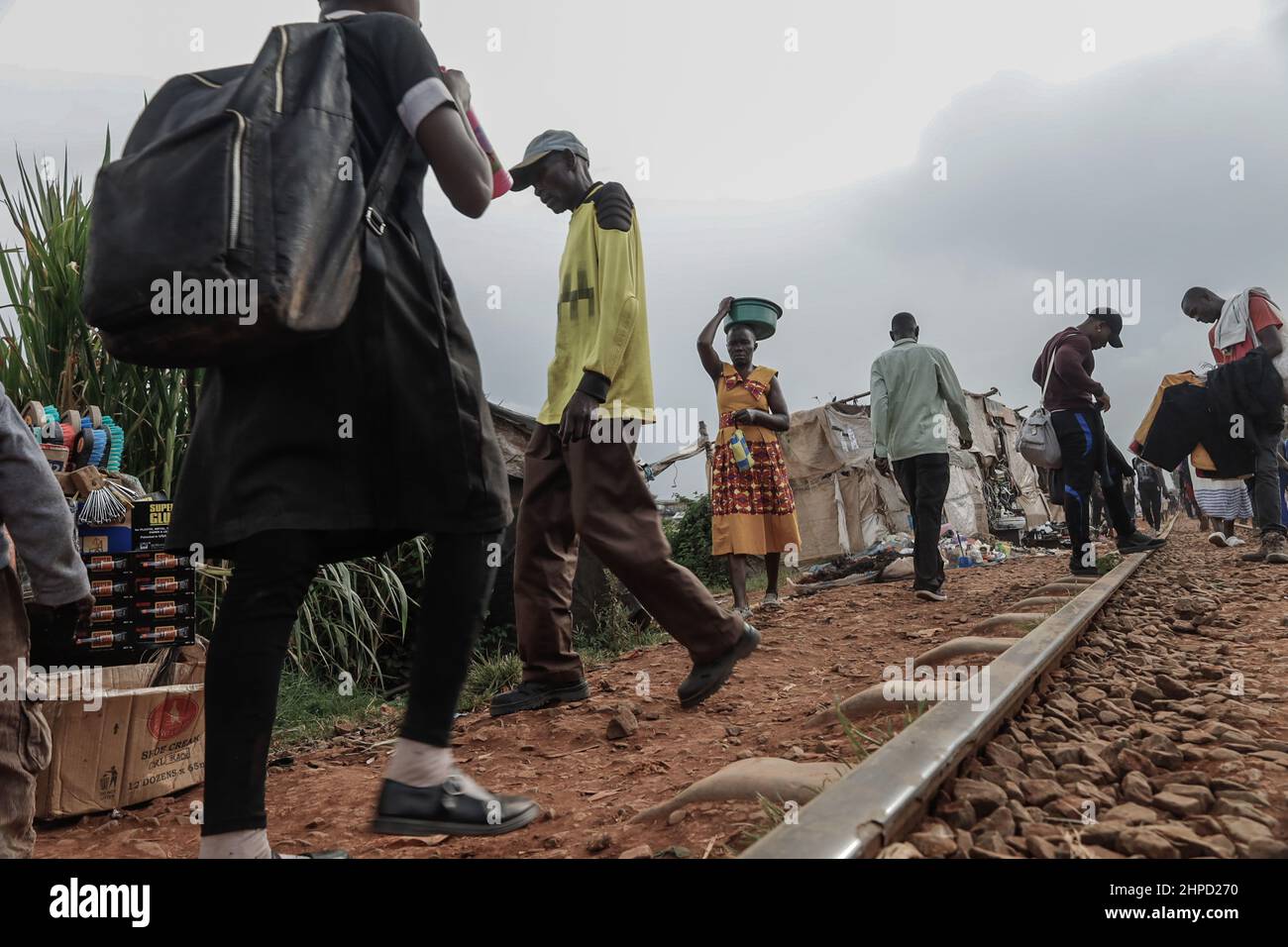 Local residents focus on their day-to-day business activities along the ...