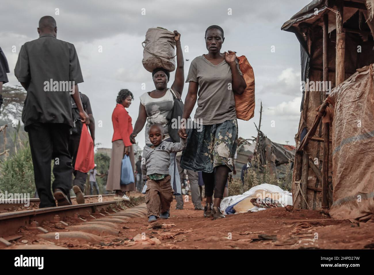 Local residents focus on their day-to-day business activities along the ...