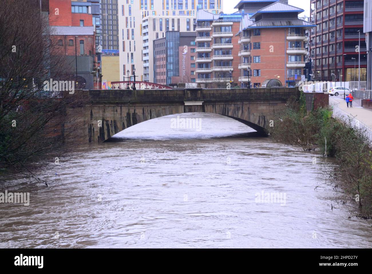 Manchester, UK, 20th February, 2022. The River Irwell is in flood but ...