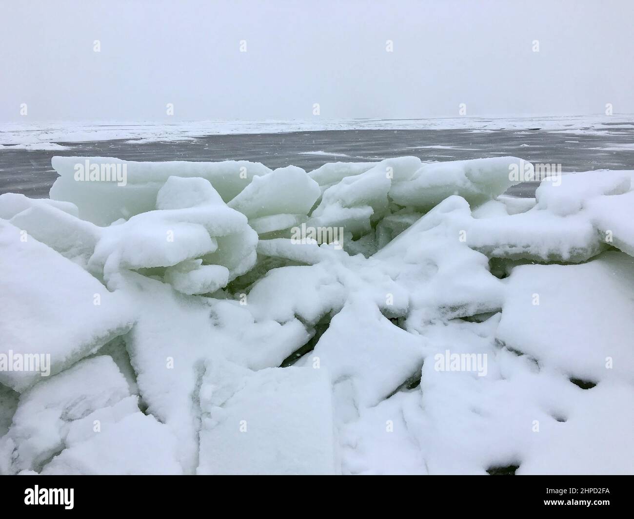 The frozen coast of the Gulf of Finland with a bizarre form of ice ...