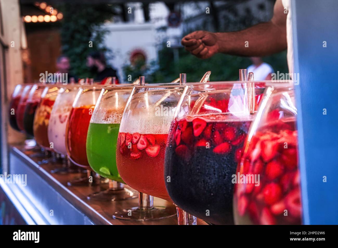 Glasses with punch of various colorful and ice cold fruits Stock Photo ...