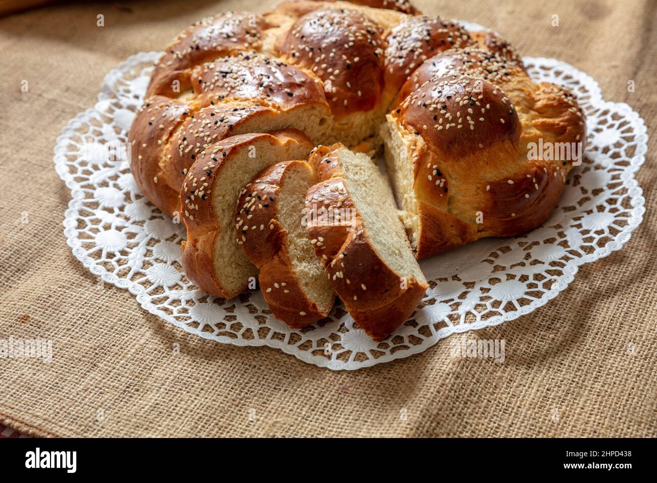 Easter sweet bread, cozonac or tsoureki slice on table, Braided cut ...